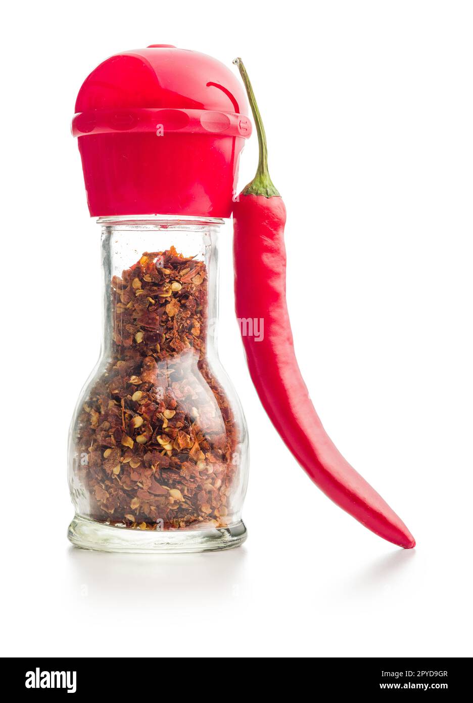 Dry chili pepper flakes. Crushed red peppers in mill and fresh red ...