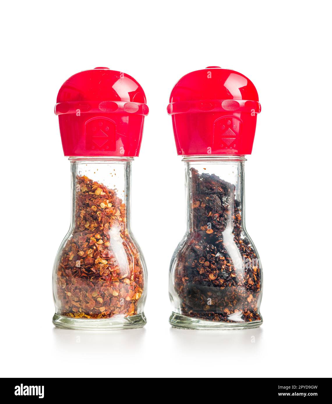 Dry chili pepper flakes. Crushed red peppers in mill isolated on white ...