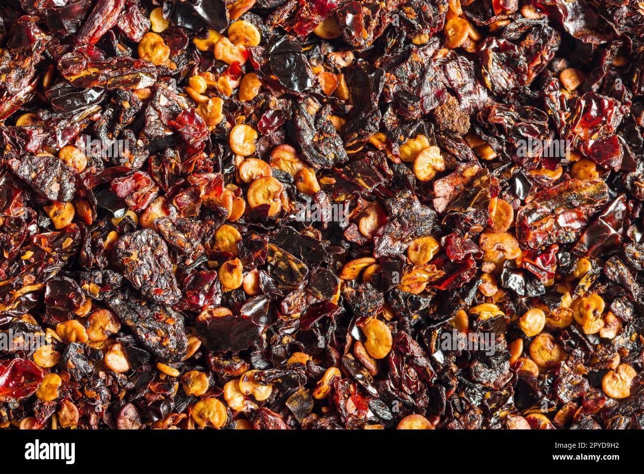 Dry chili pepper flakes. Crushed red peppers. Top view Stock Photo - Alamy