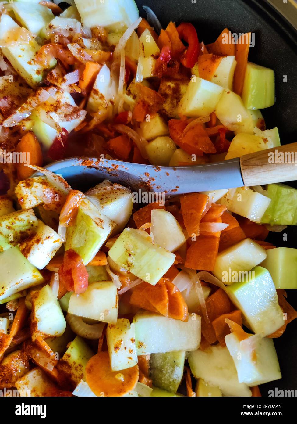 Process of cooking saute at home. Stewed vegetables and silicone ...