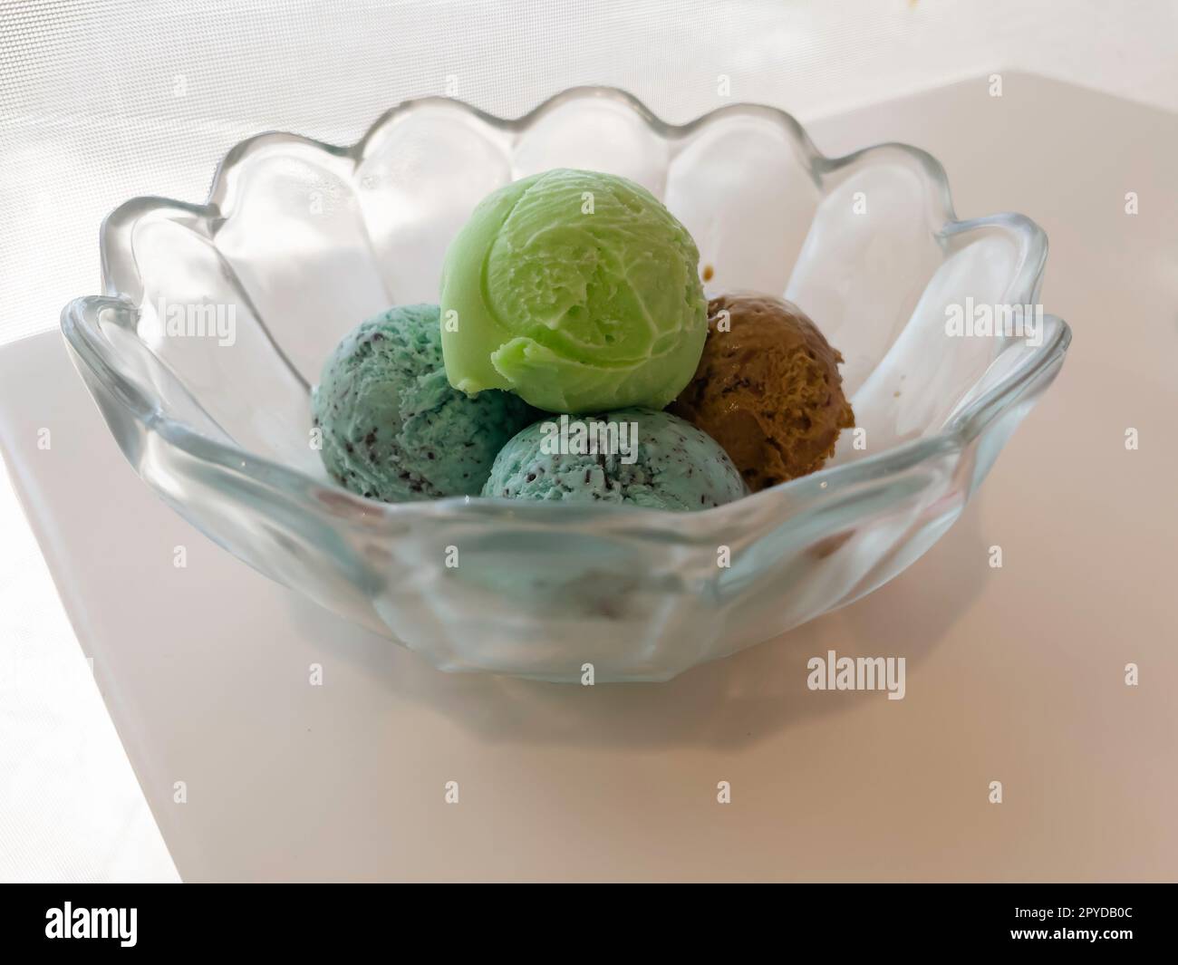 Ice cream scoops in glass bowl Stock Photo - Alamy