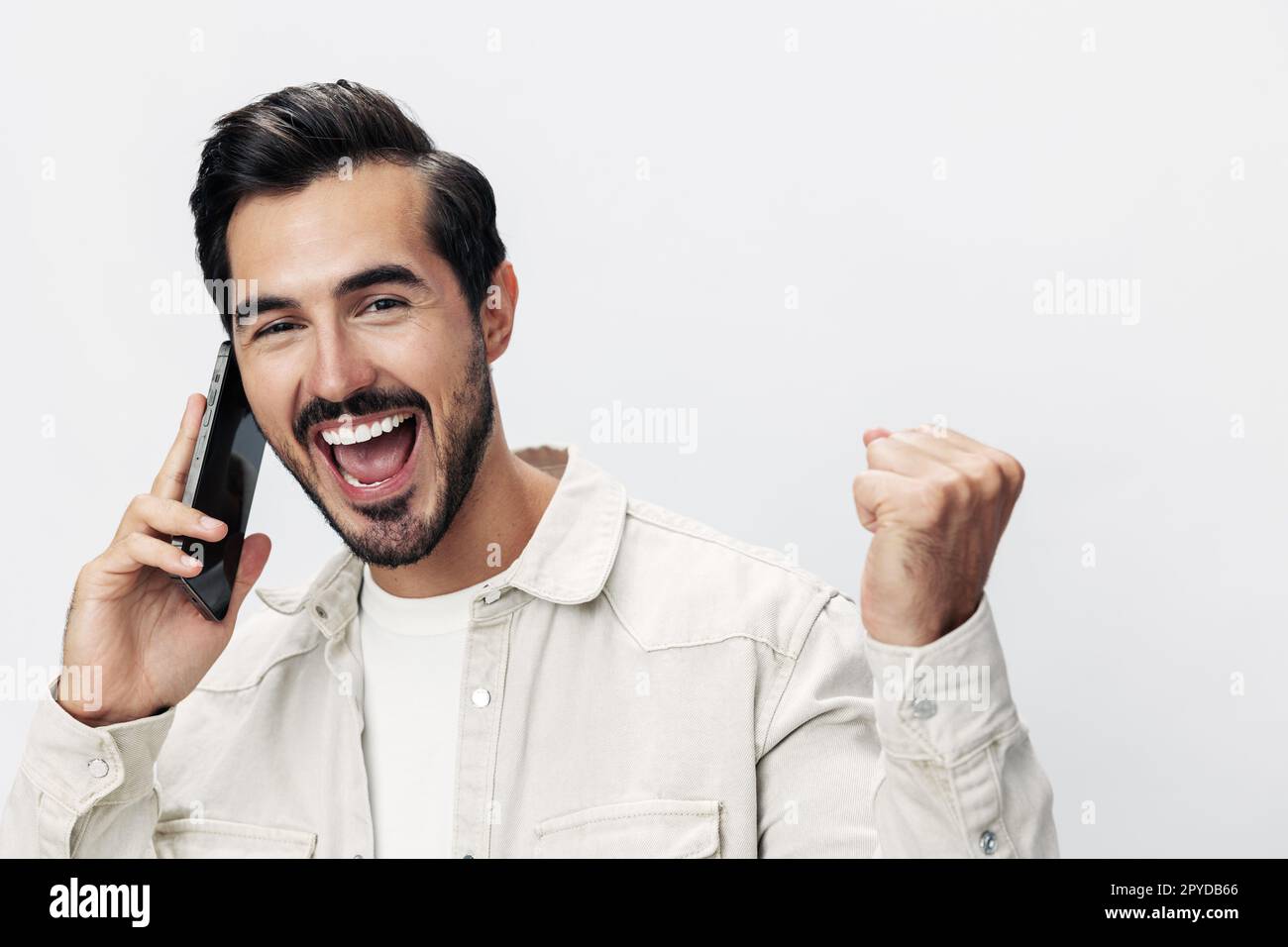 Closeup portrait man talking on the phone smile with teeth happiness ...