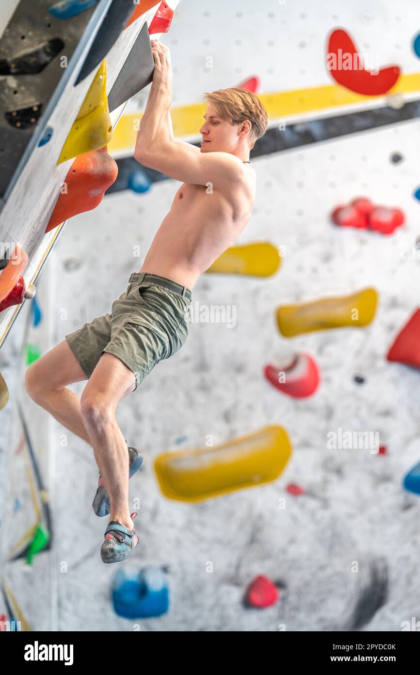 climbing on a boulder wall in a climbing center Stock Photo - Alamy