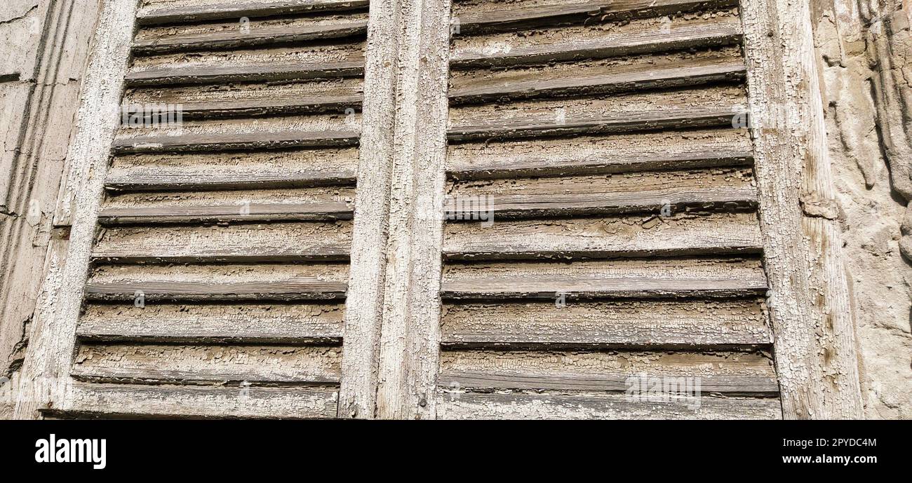 Old wooden shutters on the window. Antique wooden architecture. Dry ...