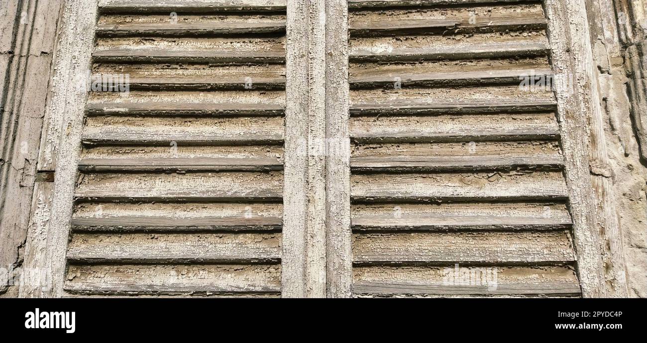 Old wooden shutters on the window. Antique wooden architecture. Dry ...