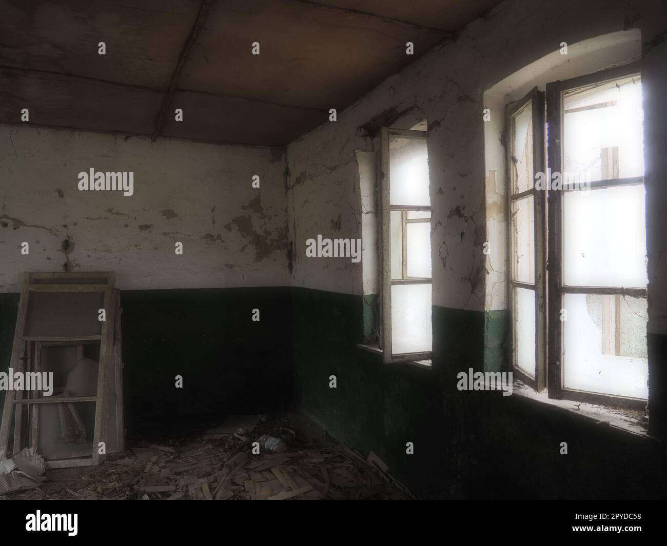 Scary windows. Inside an abandoned house. View of broken windows ...
