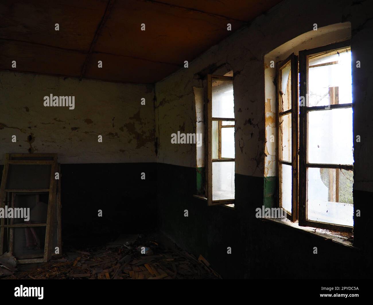 Scary windows. Inside an abandoned house. View of broken windows ...
