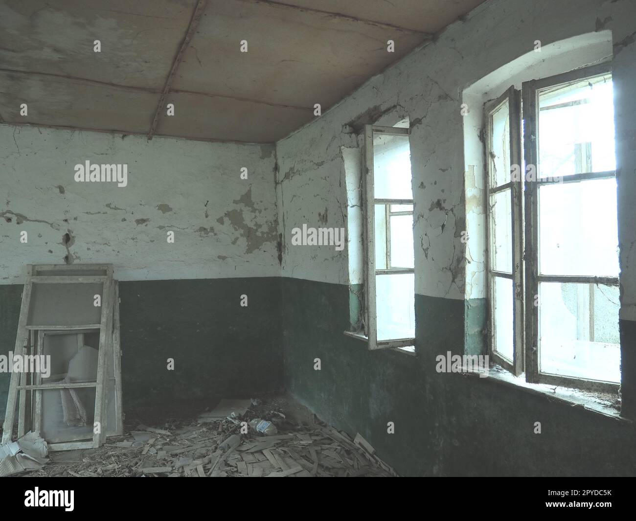Scary windows. Inside an abandoned house. View of broken windows ...