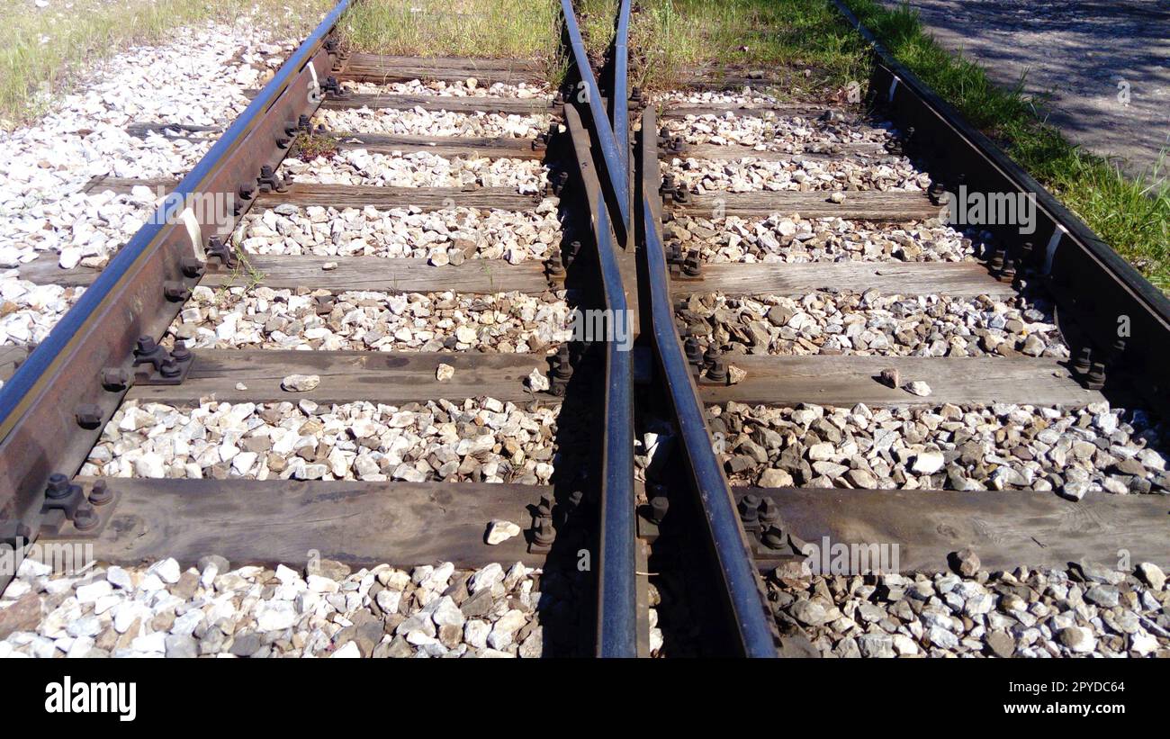 railways. Rails and sleepers on the ground near the station. Long way ...