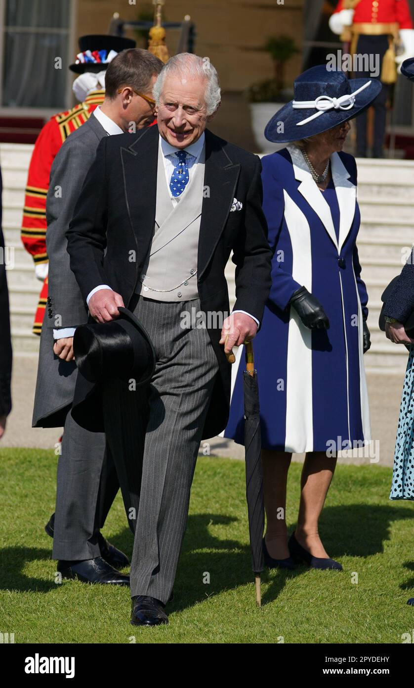 King Charles III and the Queen Consort during a Garden Party at ...