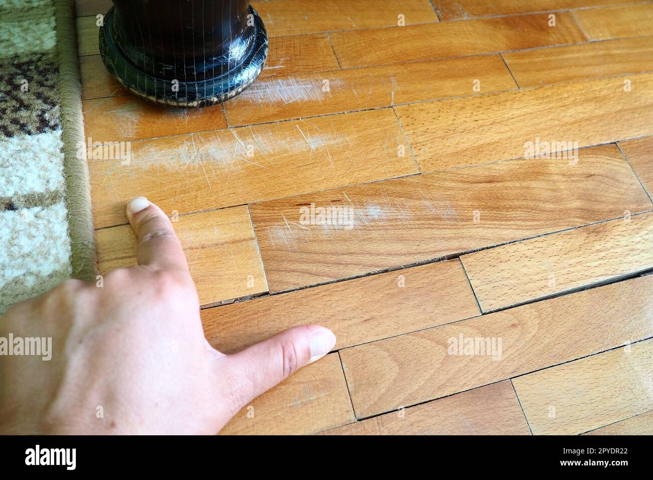 Scratched old parquet flooring needs maintenance. The parquet is ...