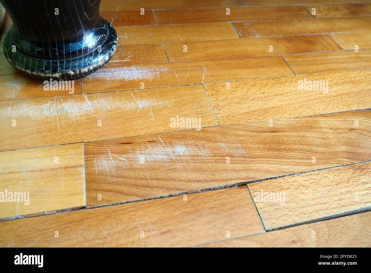 Scratched old parquet flooring needs maintenance. The parquet is ...