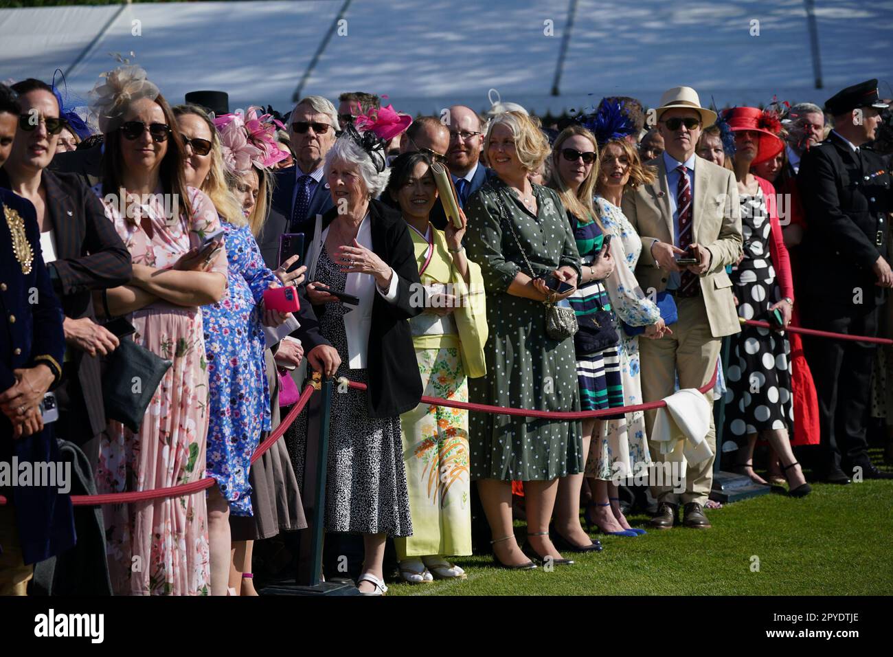 Guests attending a Garden Party at Buckingham Palace, London, to celebrate the coronation of ...