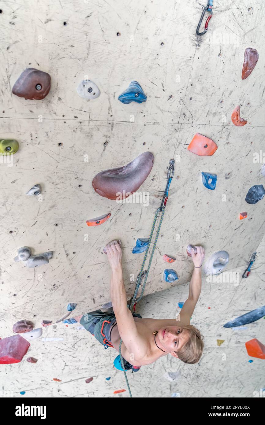 climbing artificial climbing walls with belay rope Stock Photo - Alamy