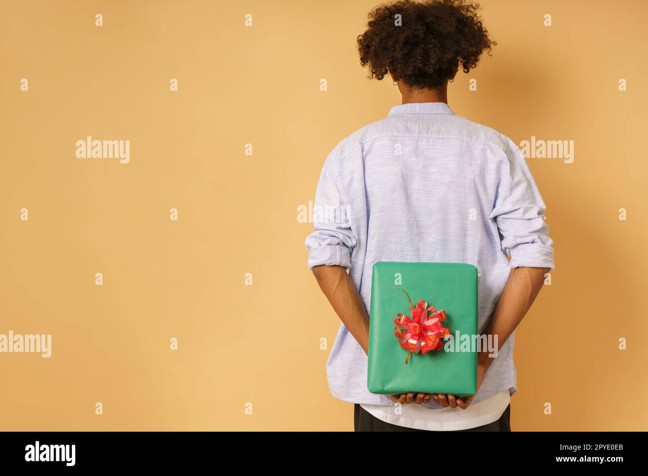 Man is ready to give a christmas present Stock Photo - Alamy