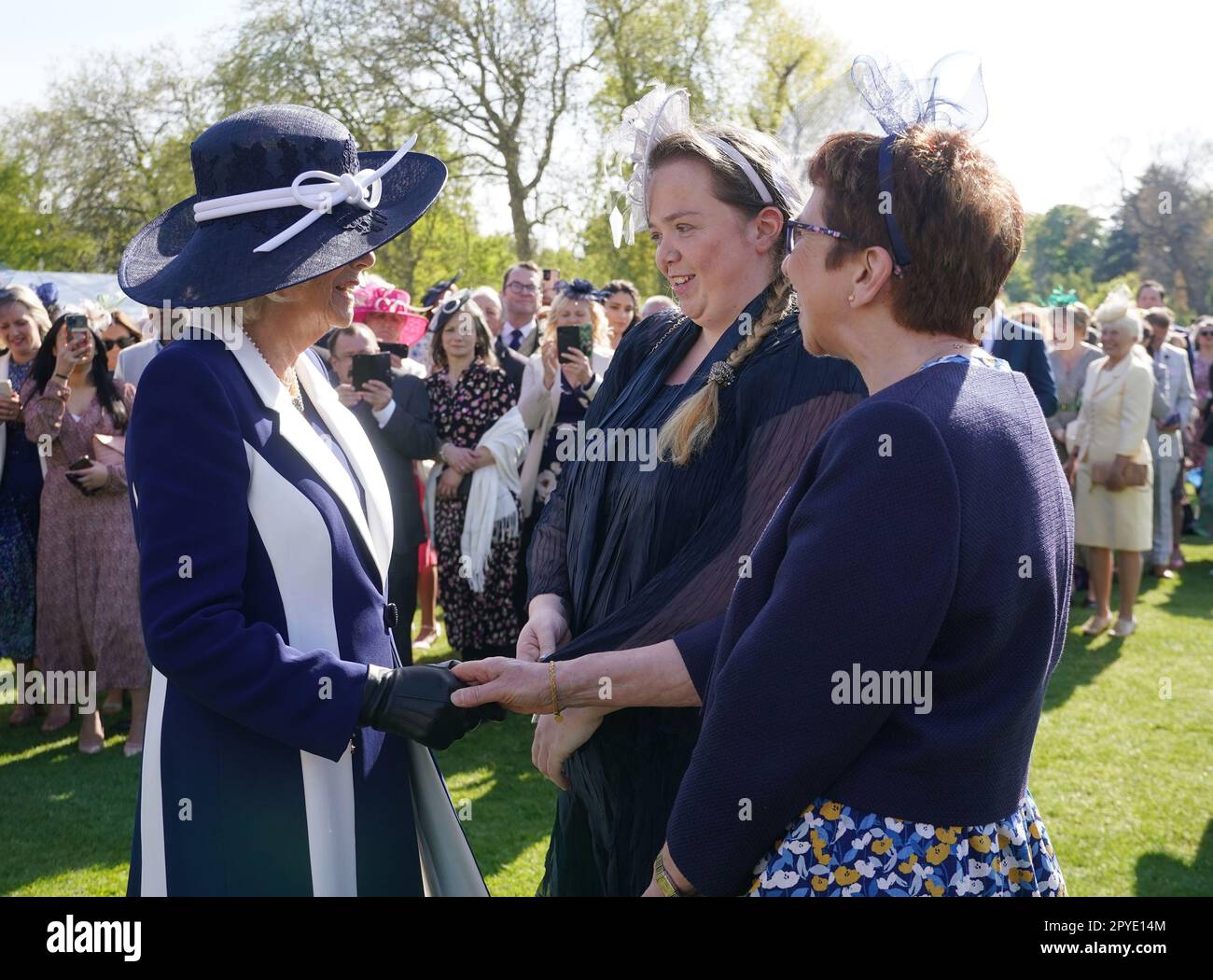 The Queen Consort meeting Niamh (centre) and Helen King, during a ...