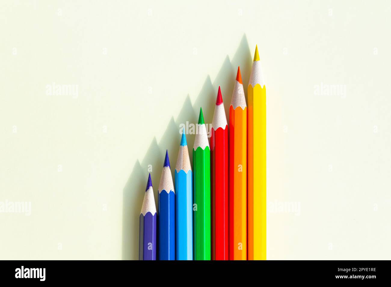A large number of sharpened colored pencils with falling shadow from ...
