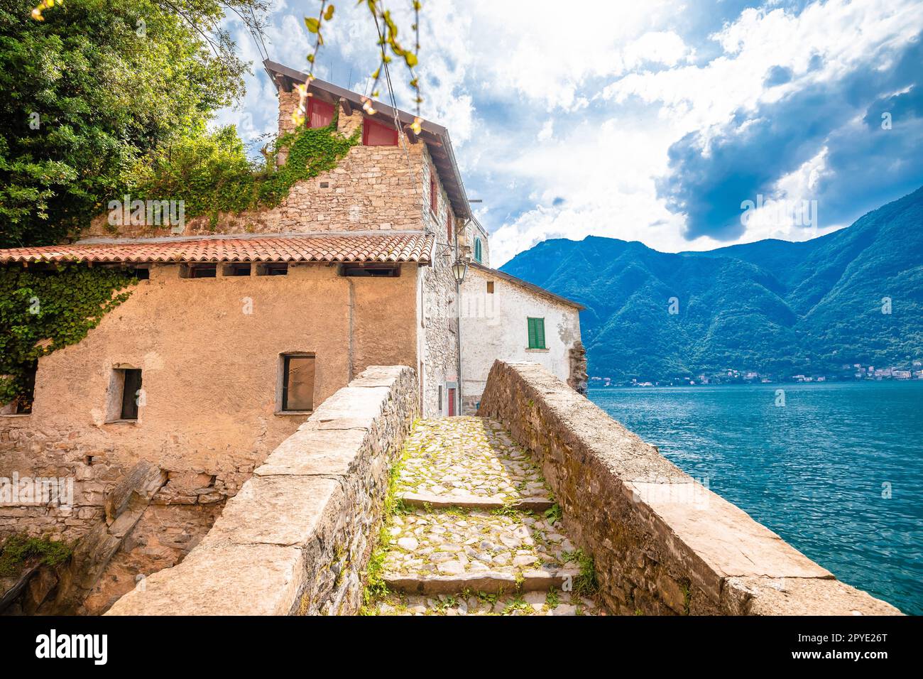 Town of Nesso historic stone bridge and scenic lakefront view Stock ...