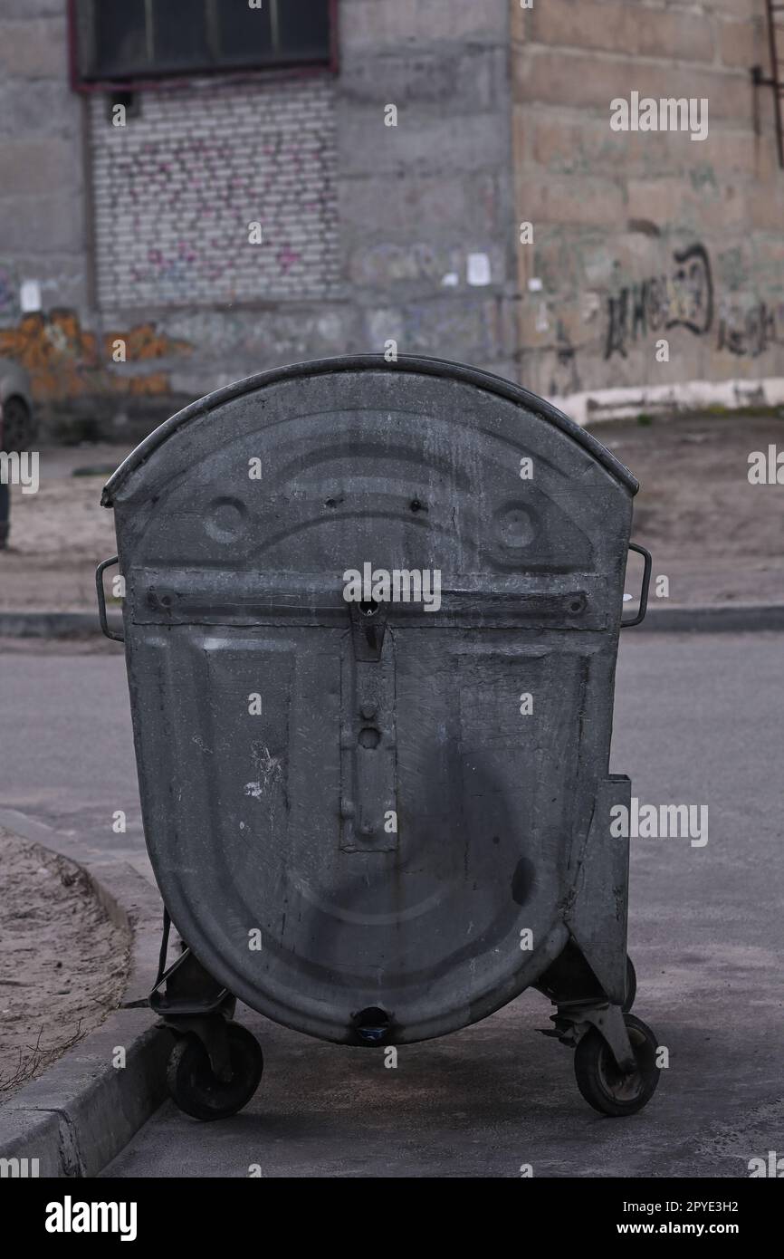 a metal garbage container in an industrial area Stock Photo - Alamy