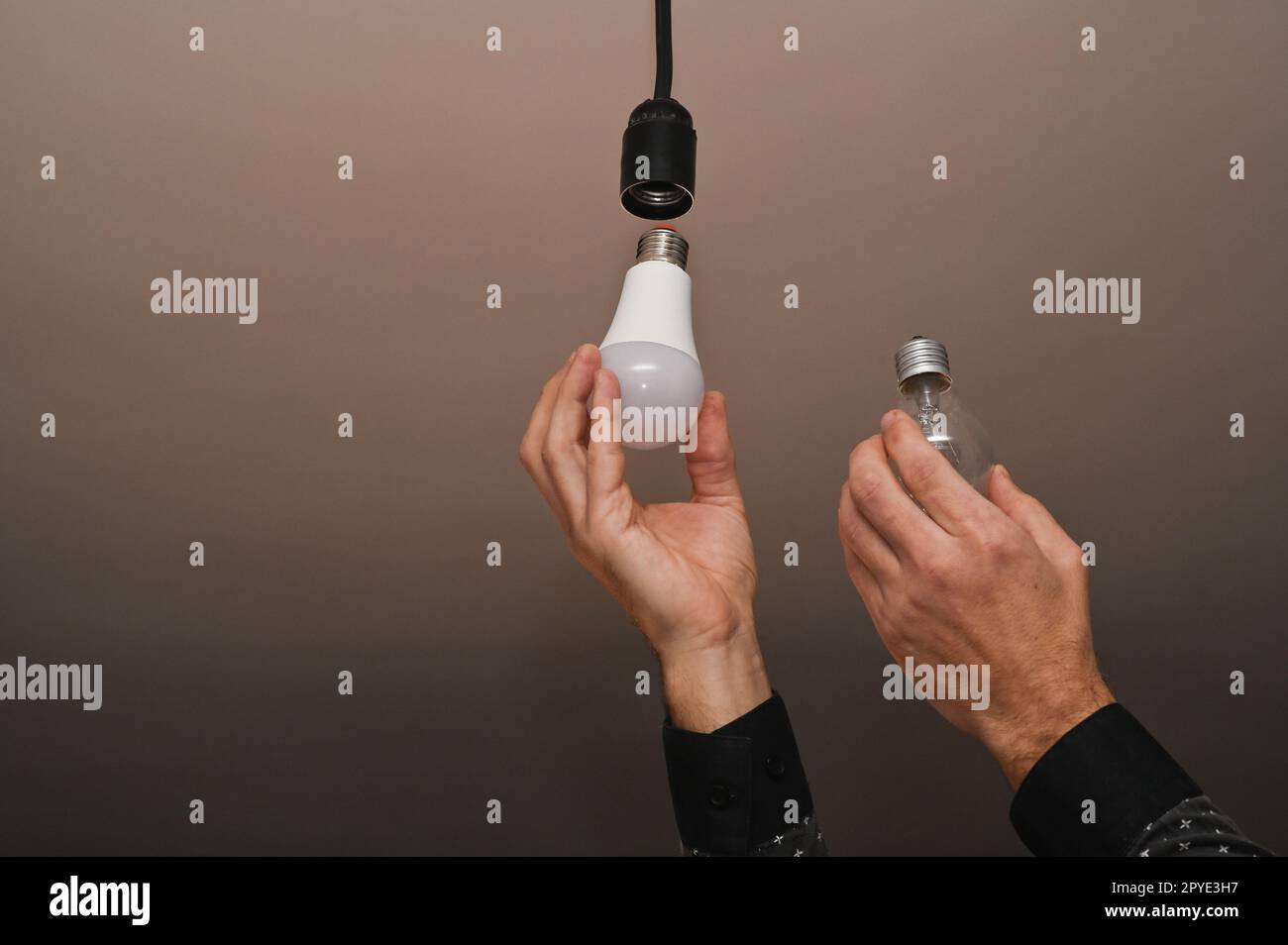 Lamps in two hands hi-res stock photography and images - Alamy