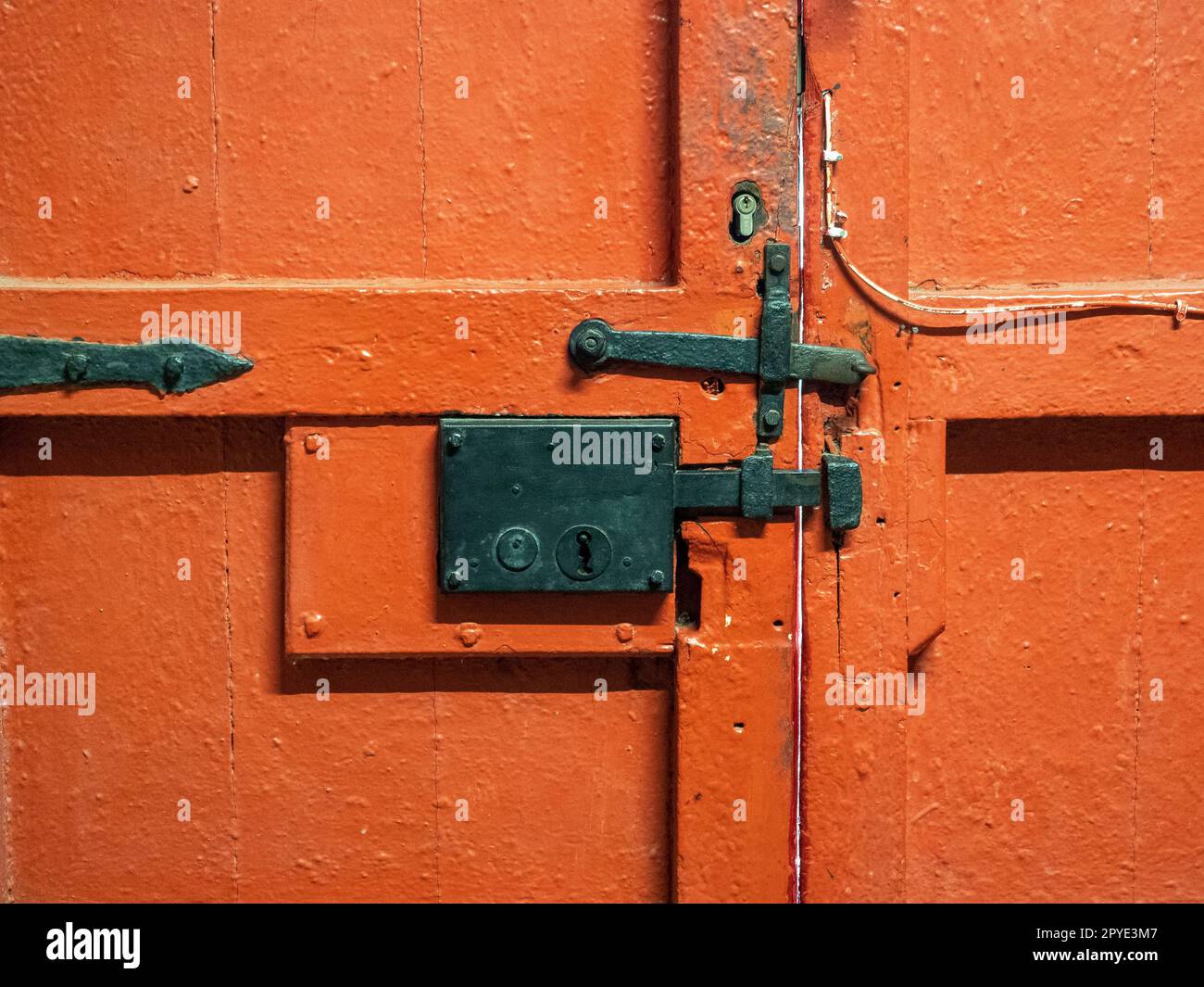 Red wooden door with lock Stock Photo - Alamy