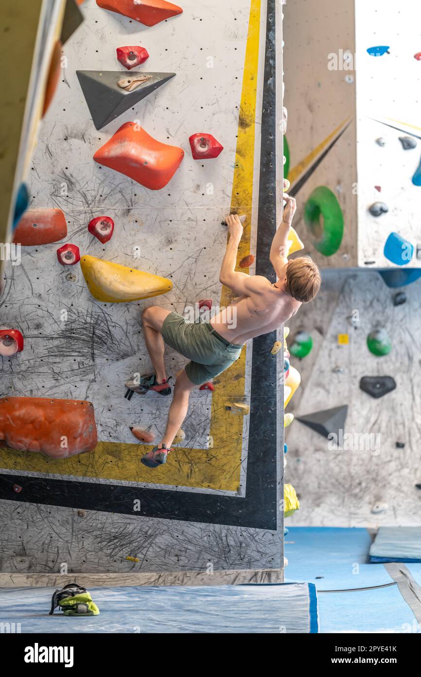 climbing on a boulder wall in a climbing center Stock Photo - Alamy