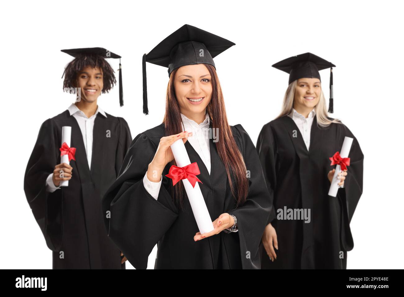 Three graduate students in black gowns holding university diplomas ...