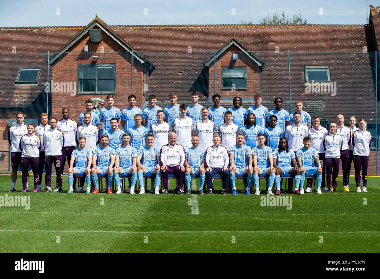 Coventry City's 1st team and staff pose for a squad photograph during a ...