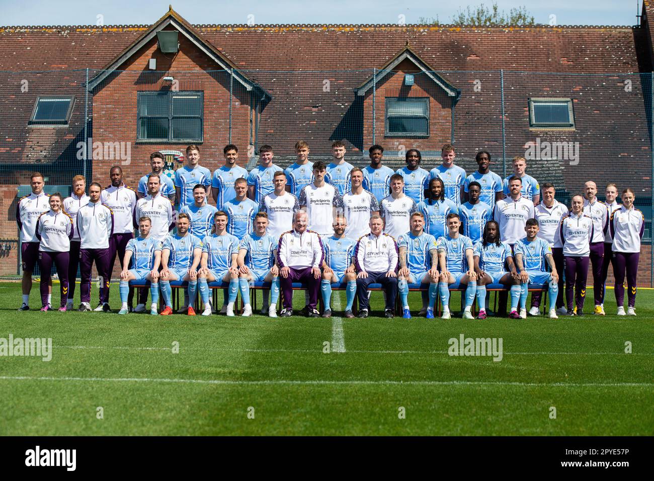 Coventry City's 1st team and staff pose for a squad photograph during a ...