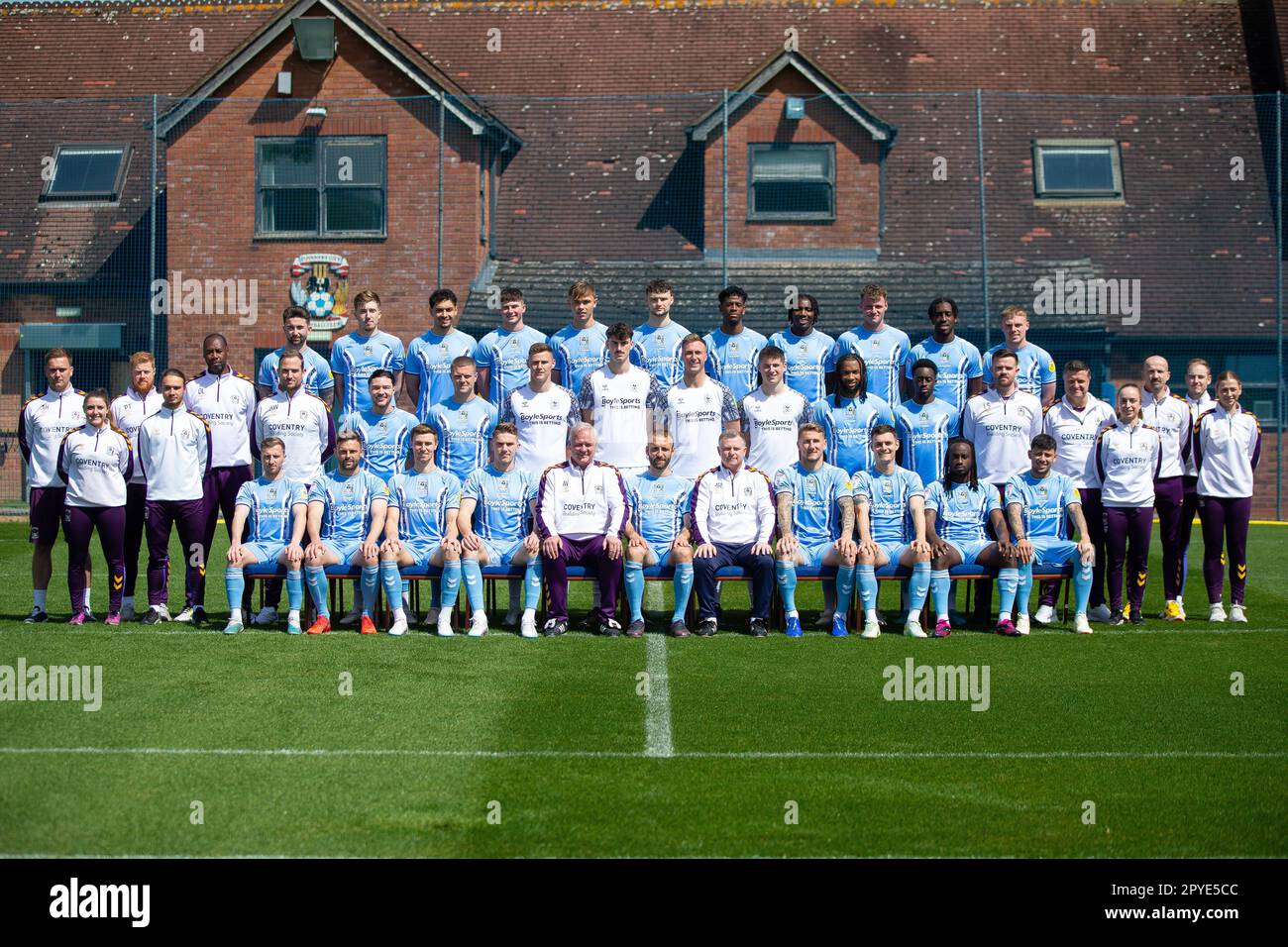 Coventry City's 1st team and staff pose for a squad photograph during a ...