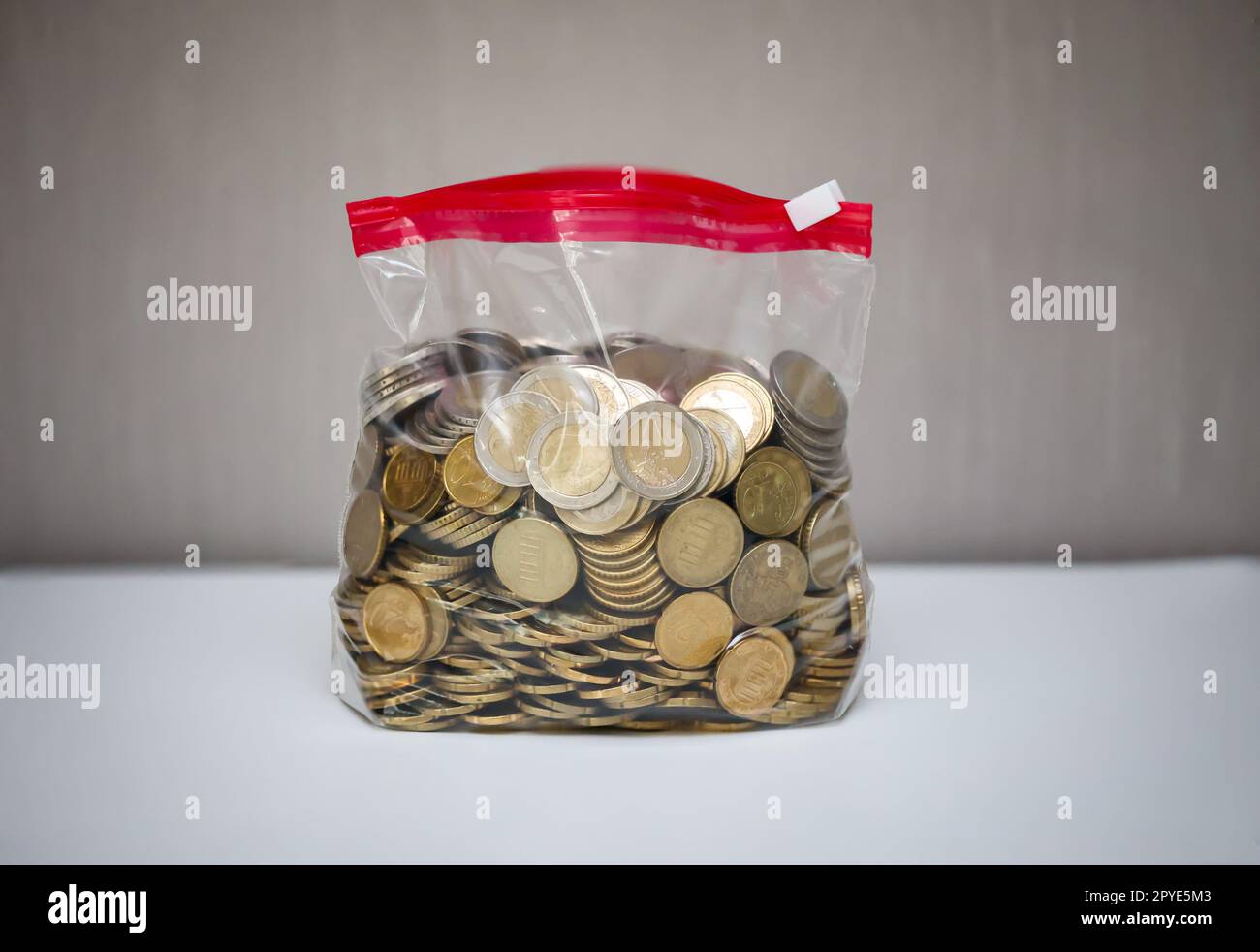 Plastic bag with coins hi-res stock photography and images - Alamy