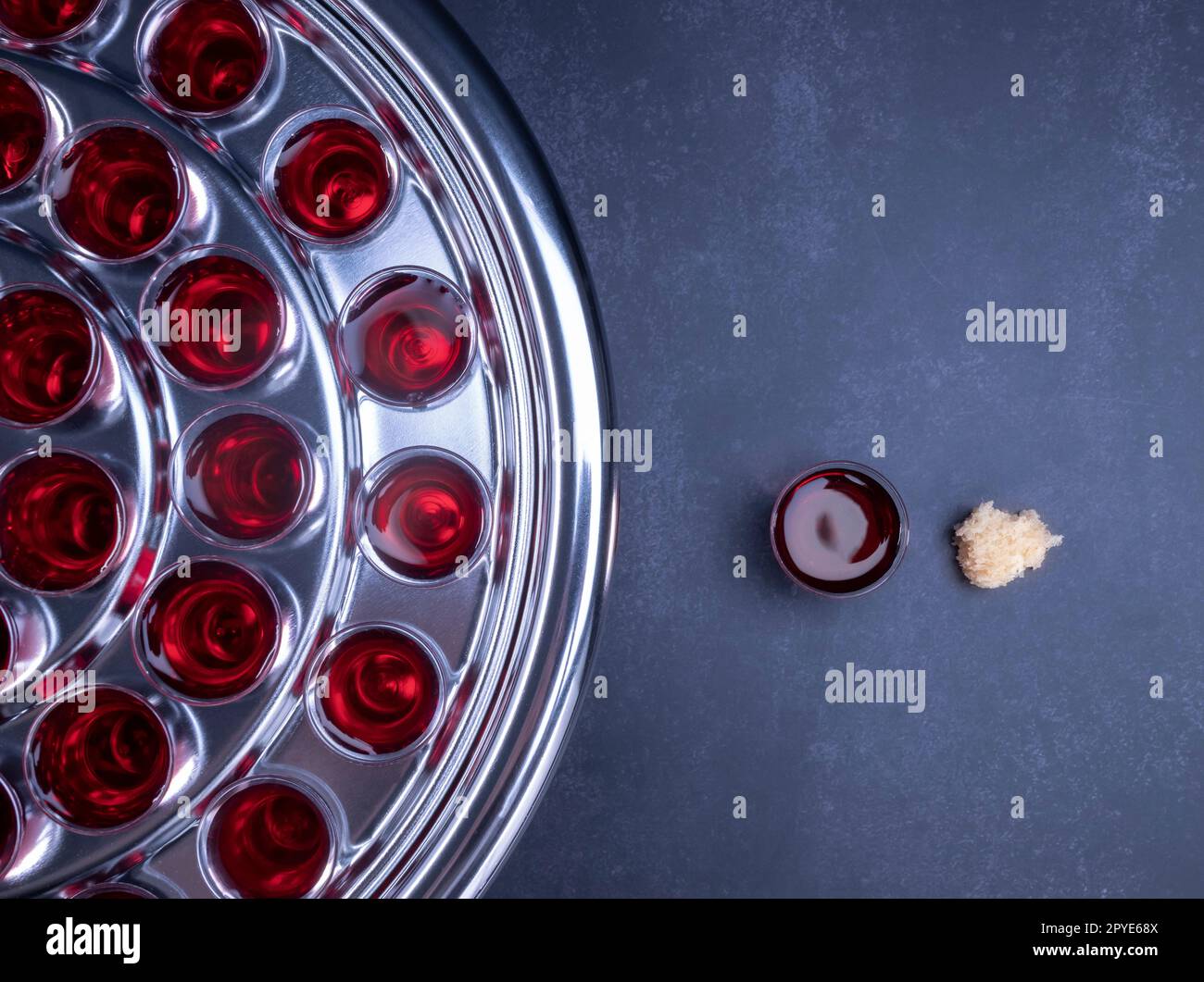 Taking communion the wine and the bread symbols on black background ...