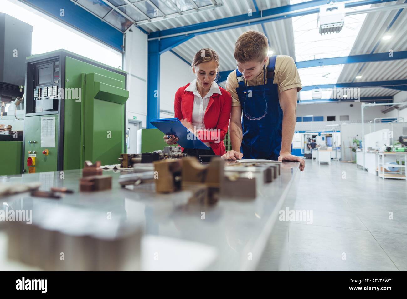 Manufacturing worker and manager during quality inspection Stock Photo ...