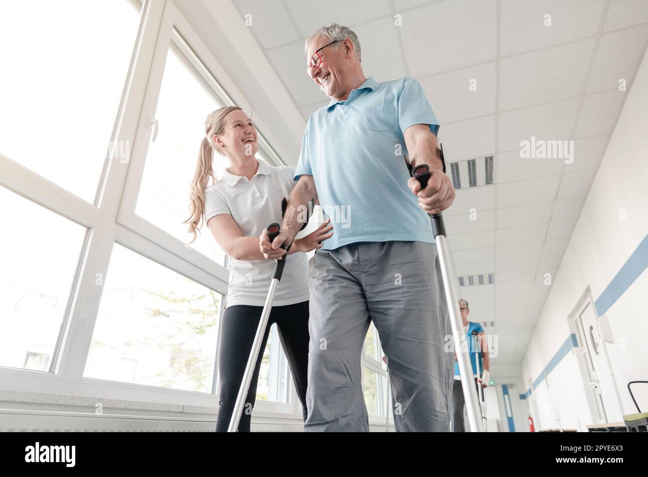 Seniors in rehabilitation learning how to walk with crutches Stock ...