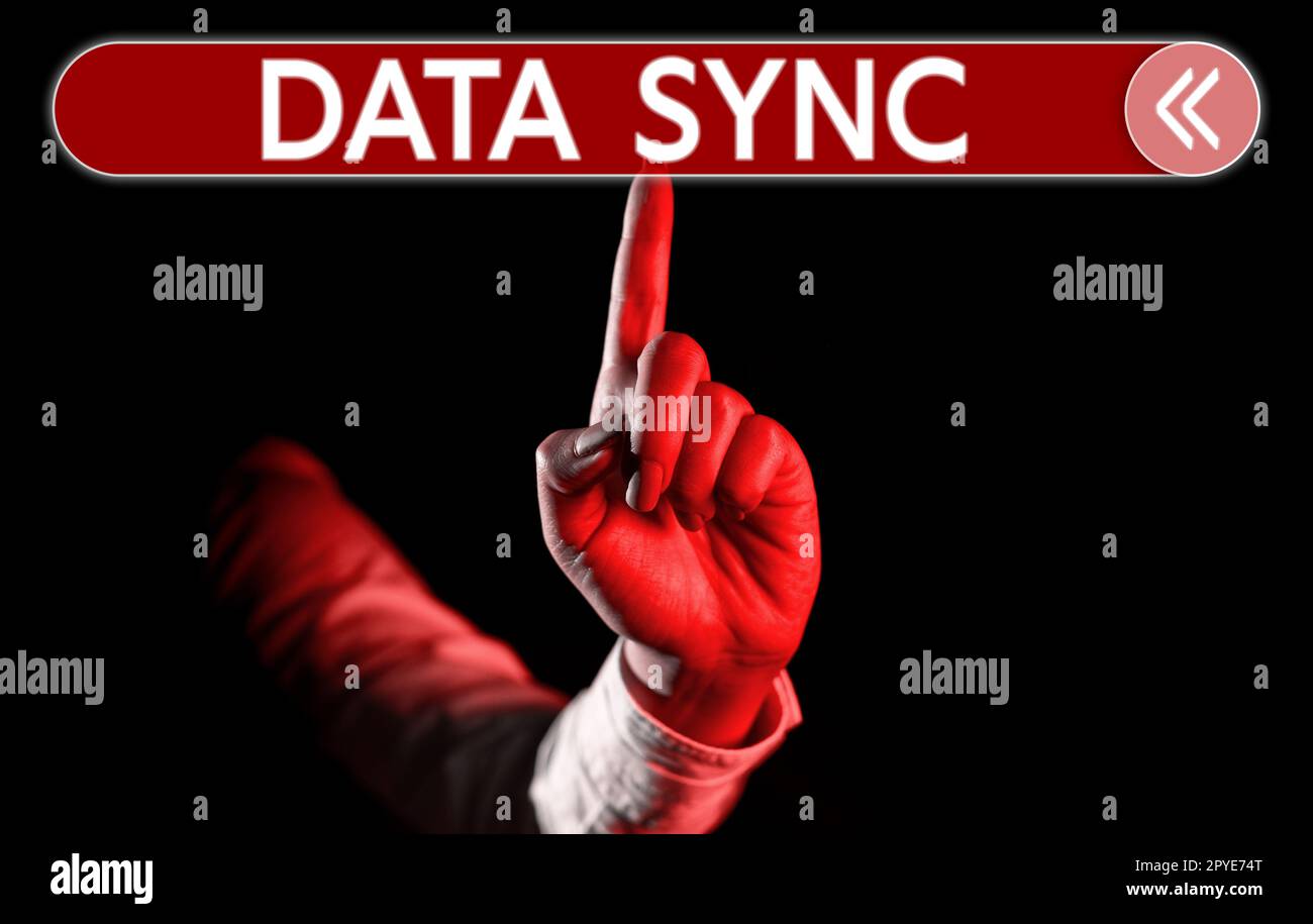 Hand writing sign Data Sync. Business overview data that is continuously generated by different ...