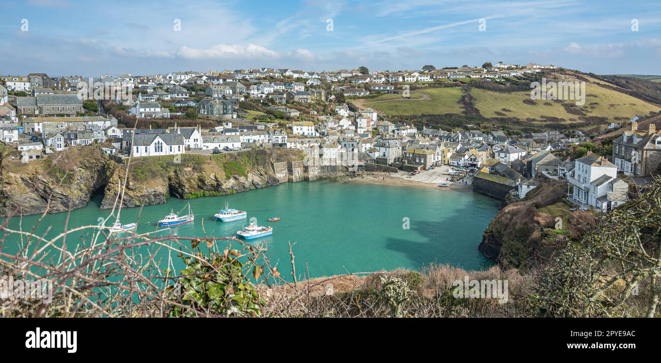 The village of Port Issac with fishing boats moored in the bay, Devon ...