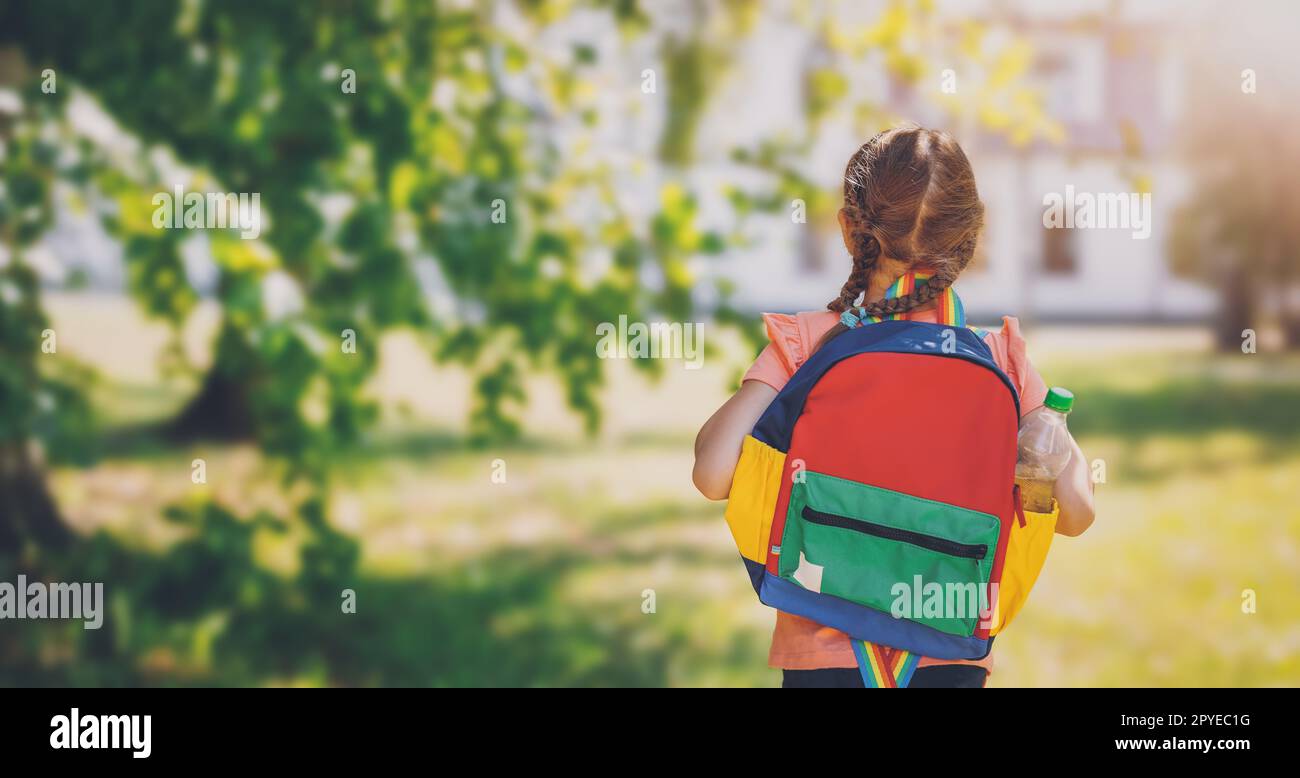 Girl going to study in primary school Stock Photo - Alamy