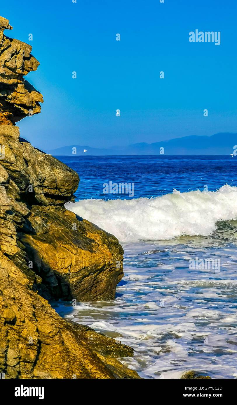 Beautiful rocks cliffs surfer waves at beach Puerto Escondido Mexico ...