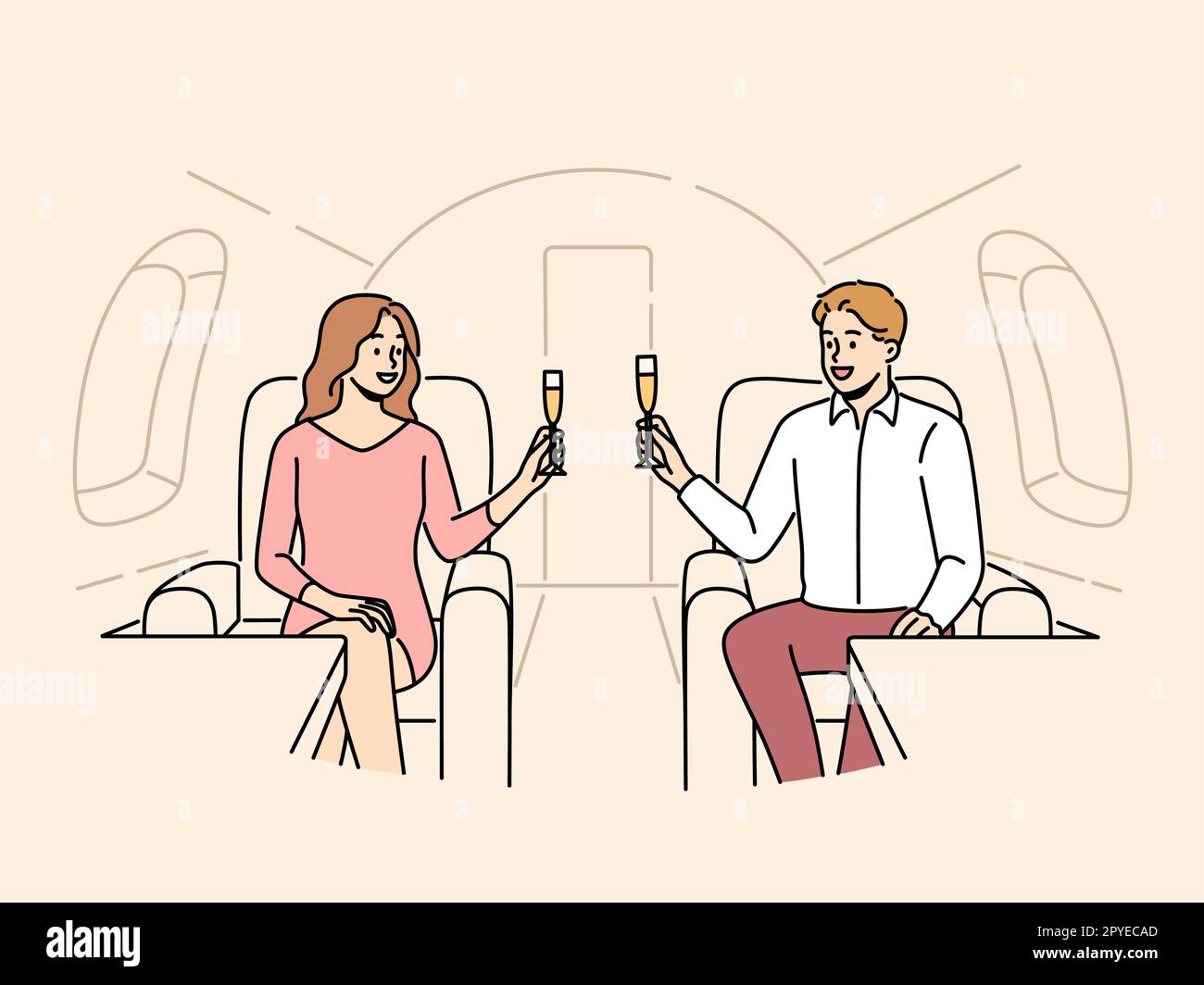 Happy couple cheers with champagne flying in private jet. Smiling ...