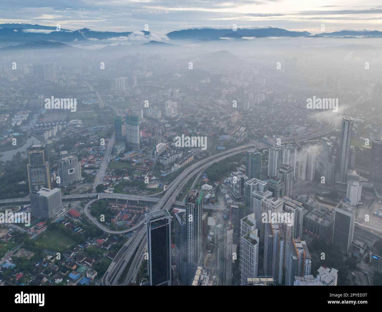 Misty cloud at Kuala Lumpur city building and highway Stock Photo - Alamy