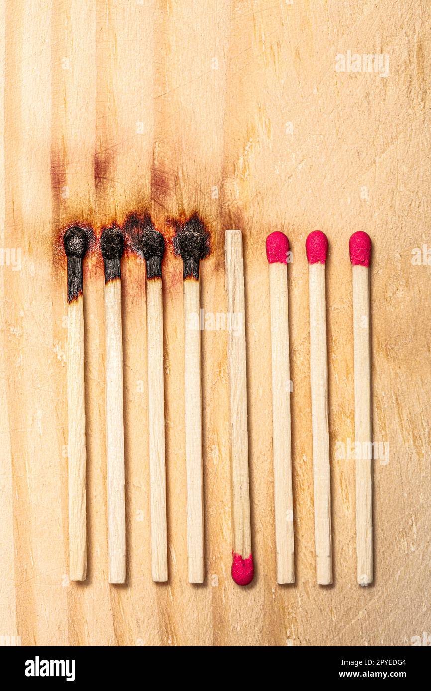 matches in a row, some of which were lit and burnt Stock Photo - Alamy