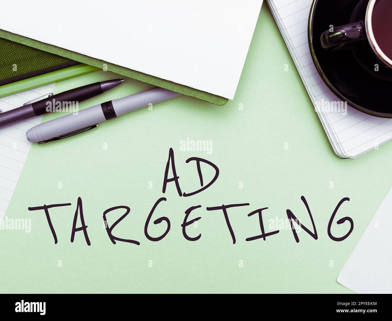 Hand writing sign Ad Targeting. Word Written on target the most ...