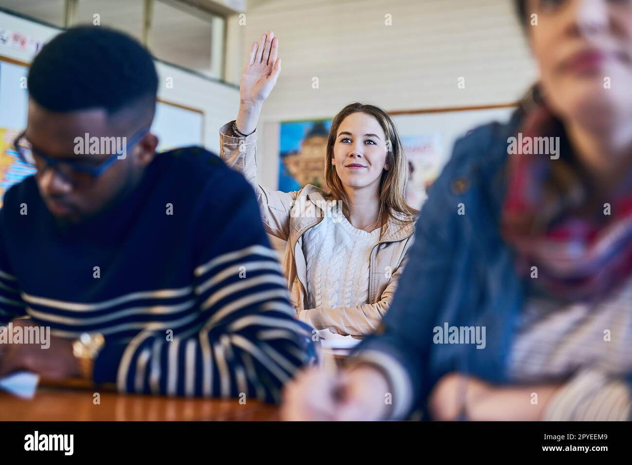 Female university student raising hand hi-res stock photography and ...