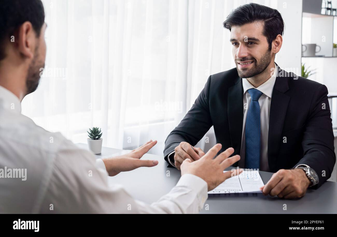 Interviewing job applicant in office with resume paper. Candidate wear ...