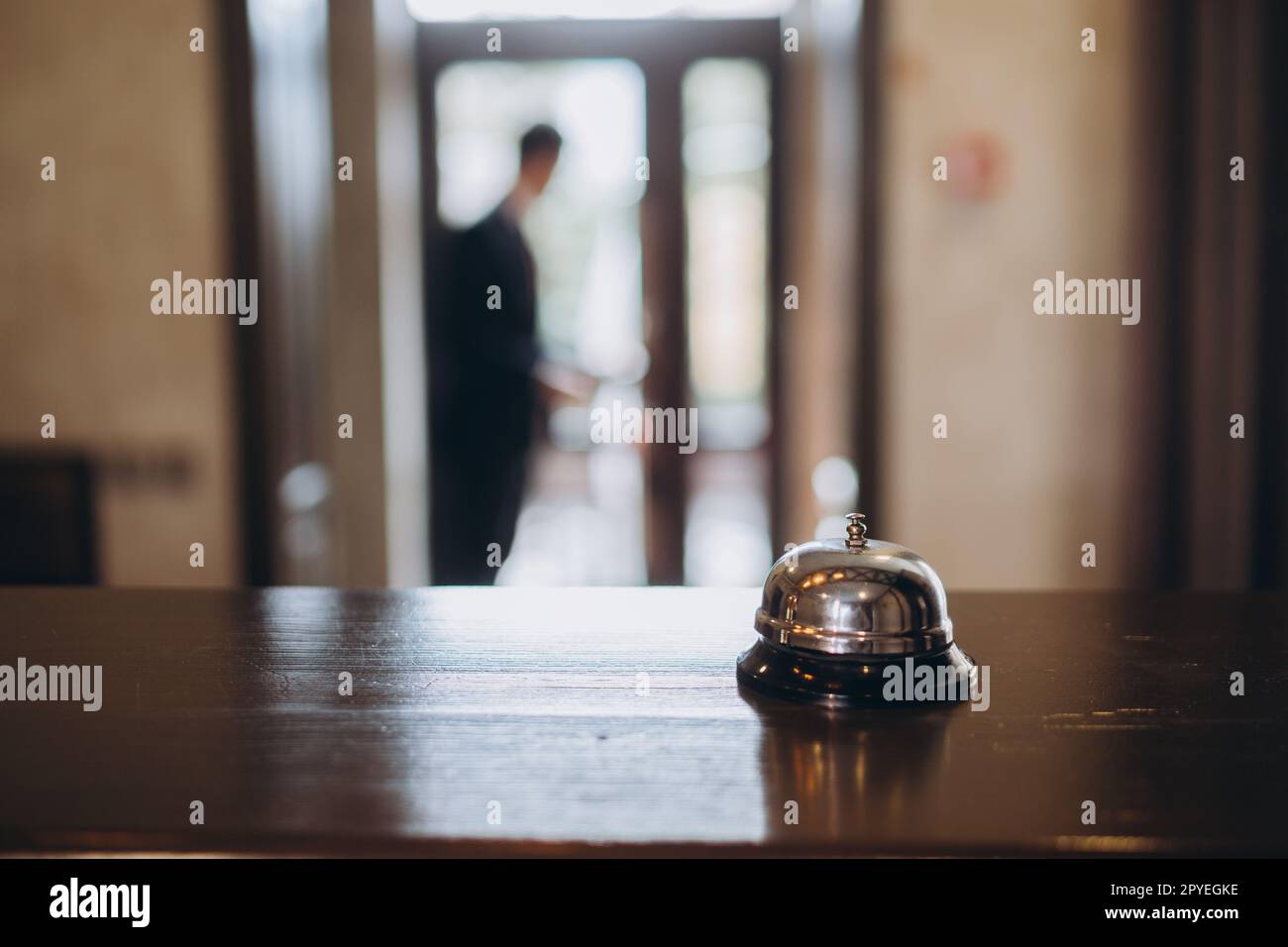 Arrival at the hotel. Reception desk with a bell in the hotel lobby ...