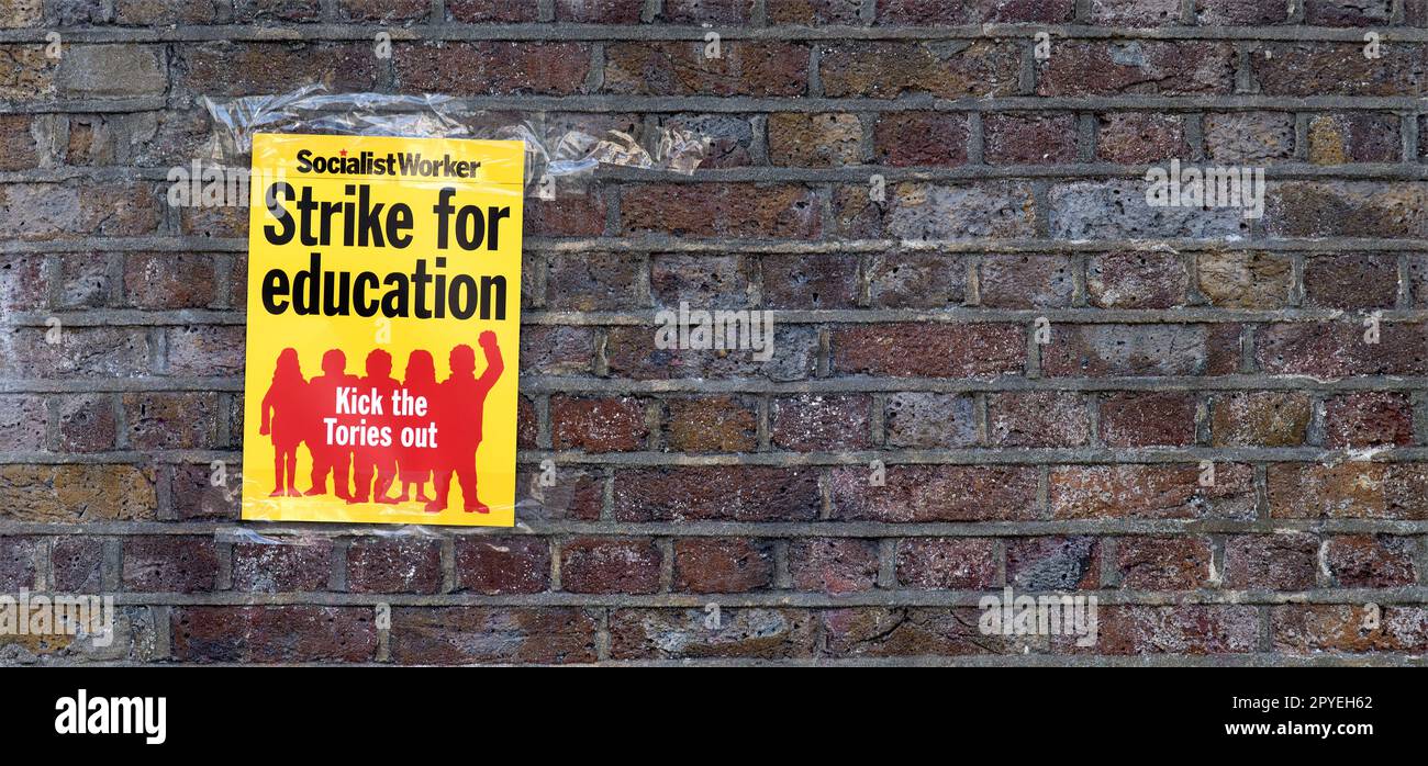 Poster on a brick wall in London from the Socialist Worker calling for ...