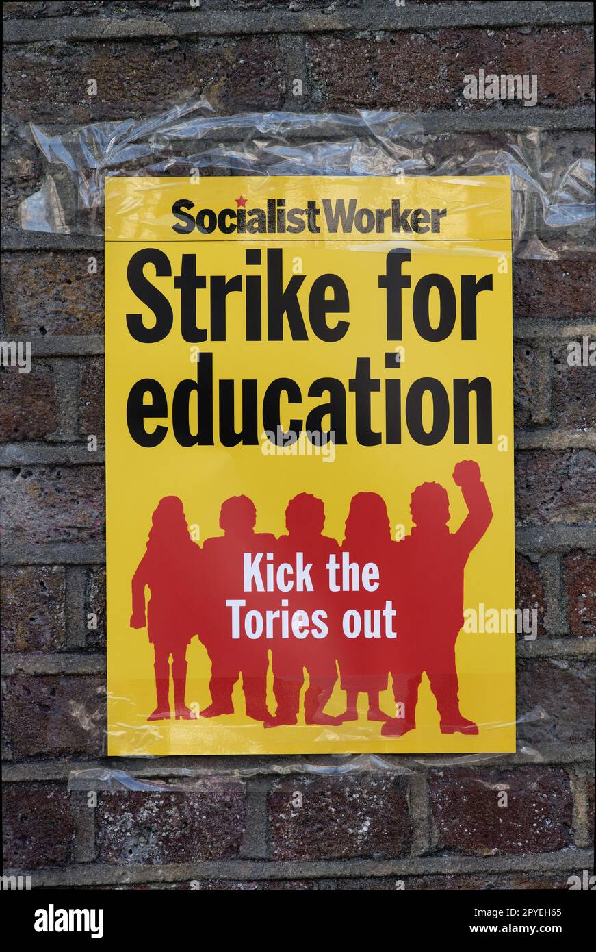 Poster on a brick wall in London from the Socialist Worker calling for ...