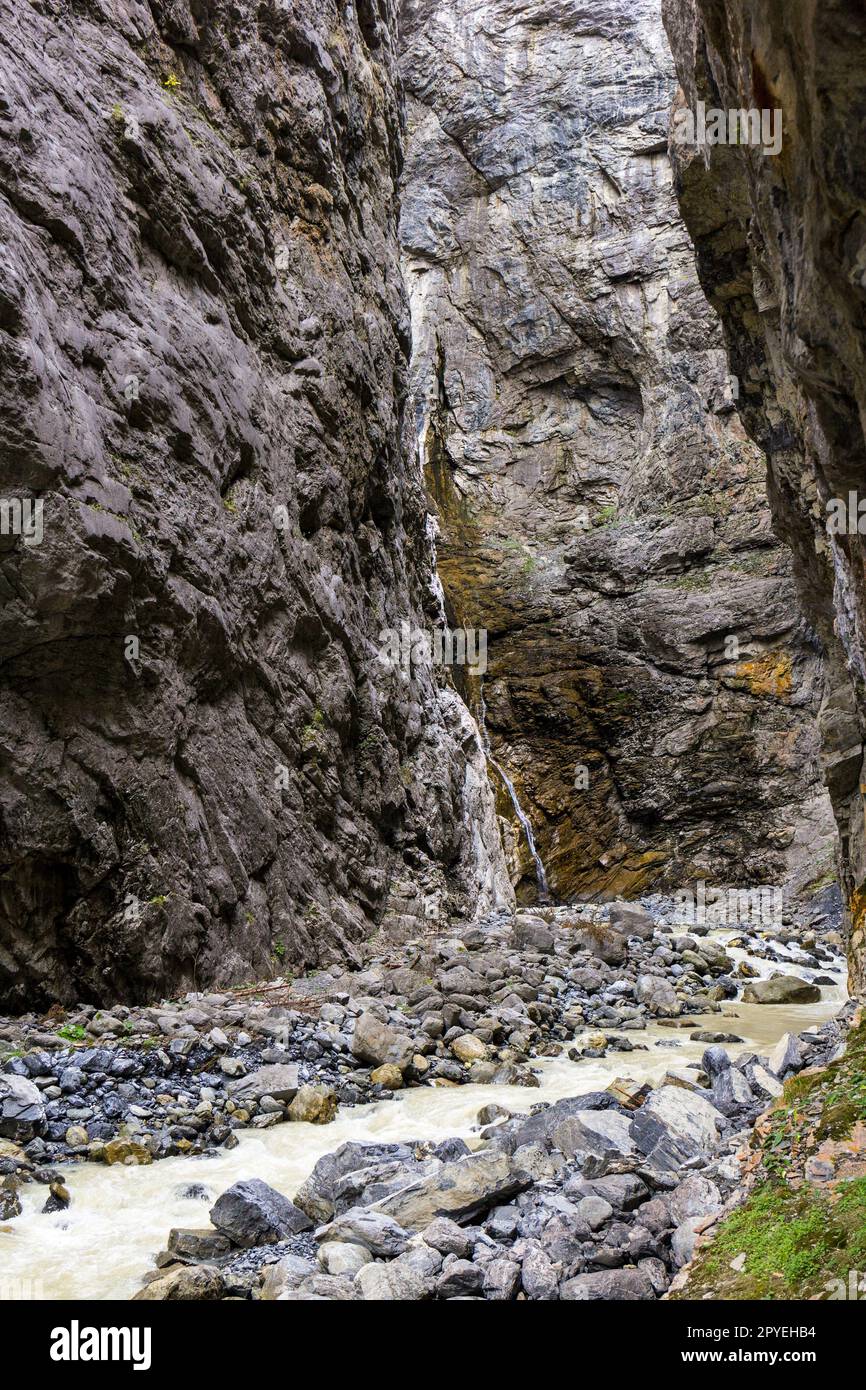 Small waterfall in the Glacier Gorge with the river Weisse Lutschine in ...