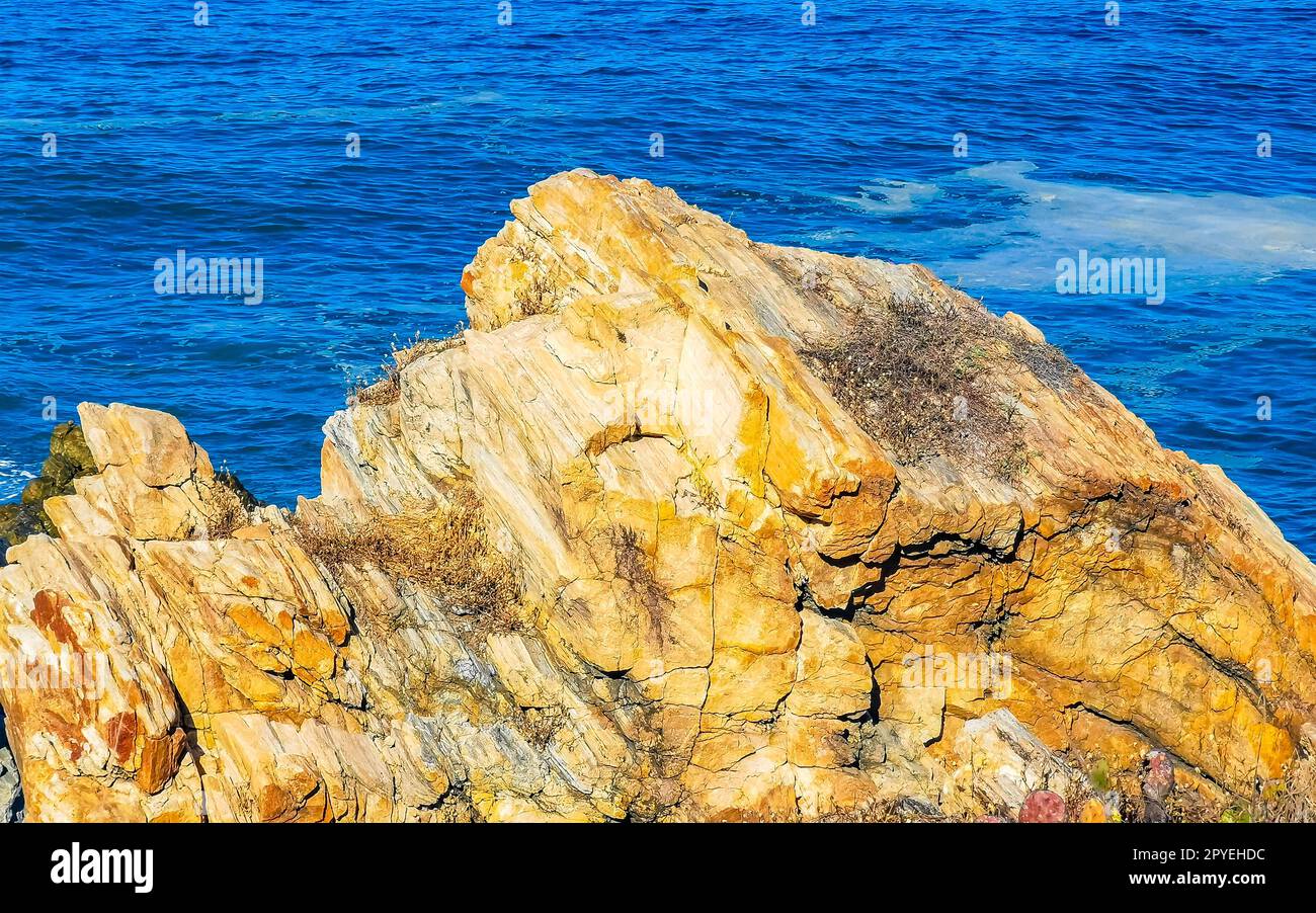 Beautiful rocks cliffs surfer waves at beach Puerto Escondido Mexico ...