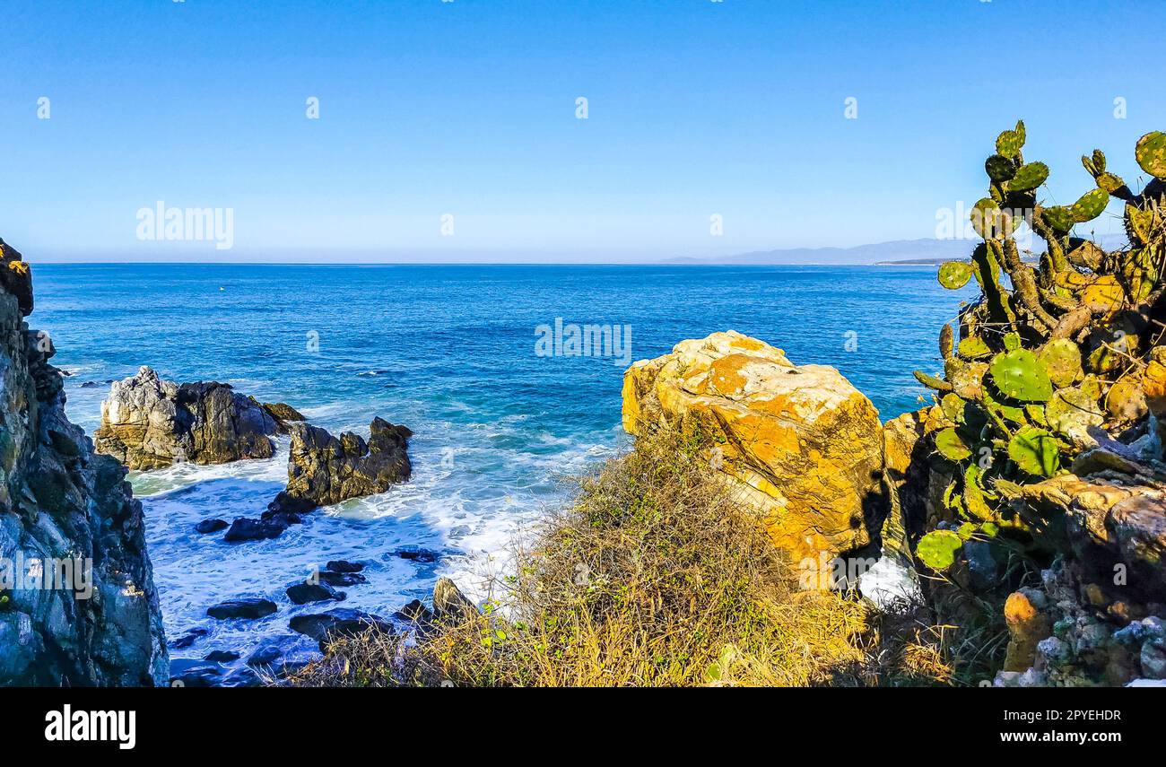 Beautiful rocks cliffs surfer waves at beach Puerto Escondido Mexico ...